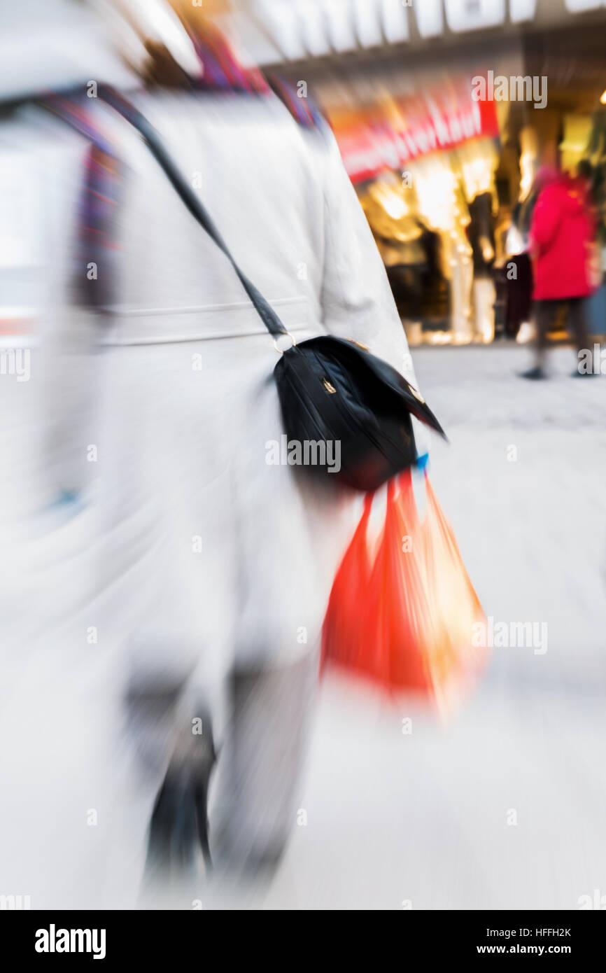 people walking on a shopping street with camera made zoom effect Stock ...