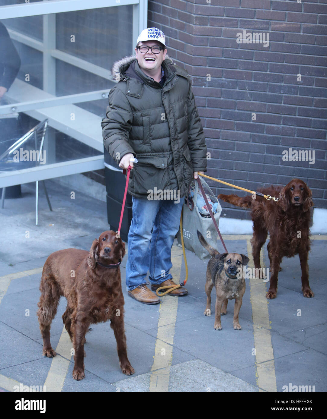 Alan Carr and his three dogs outside ITV Studios Featuring: Alan Carr ...