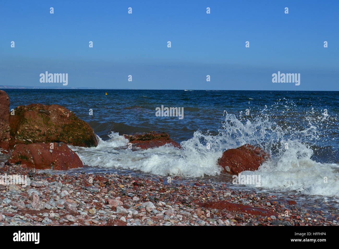 Waves Breaking on Rock Stock Photo - Alamy