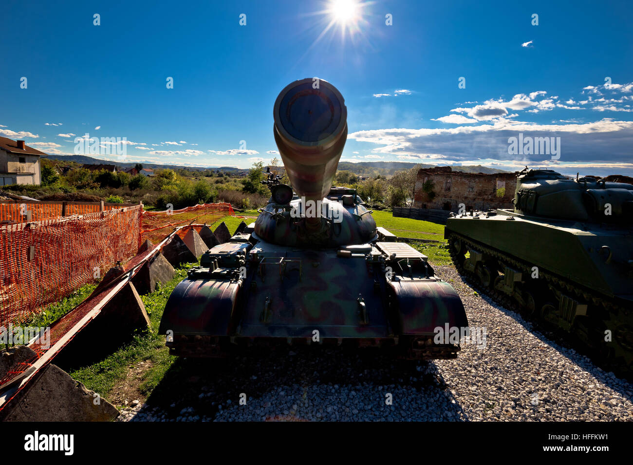 Military tank silhouette with sun rays view, Karlovac, Croatia Stock ...