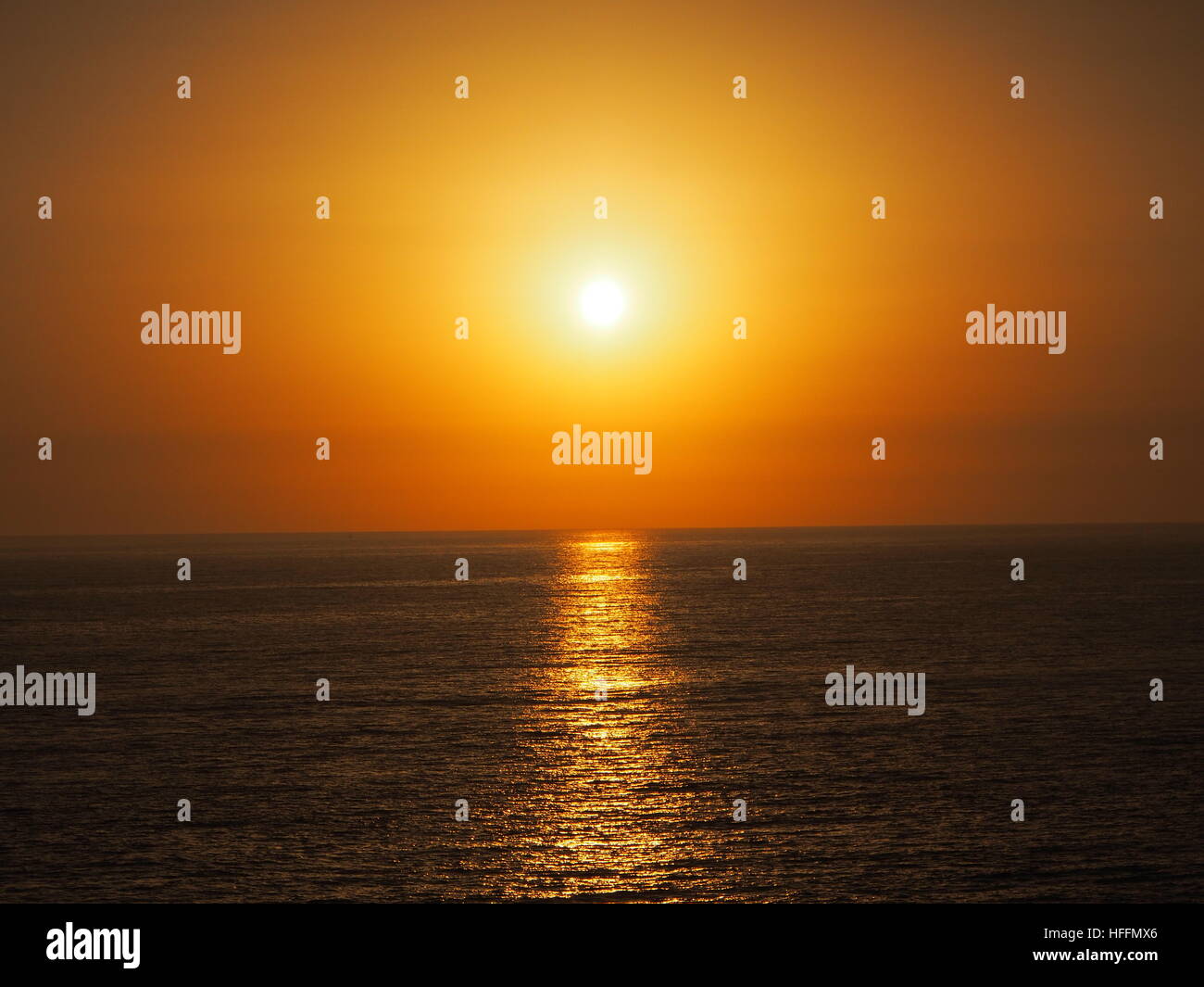 Sunset over the sea Stock Photo - Alamy