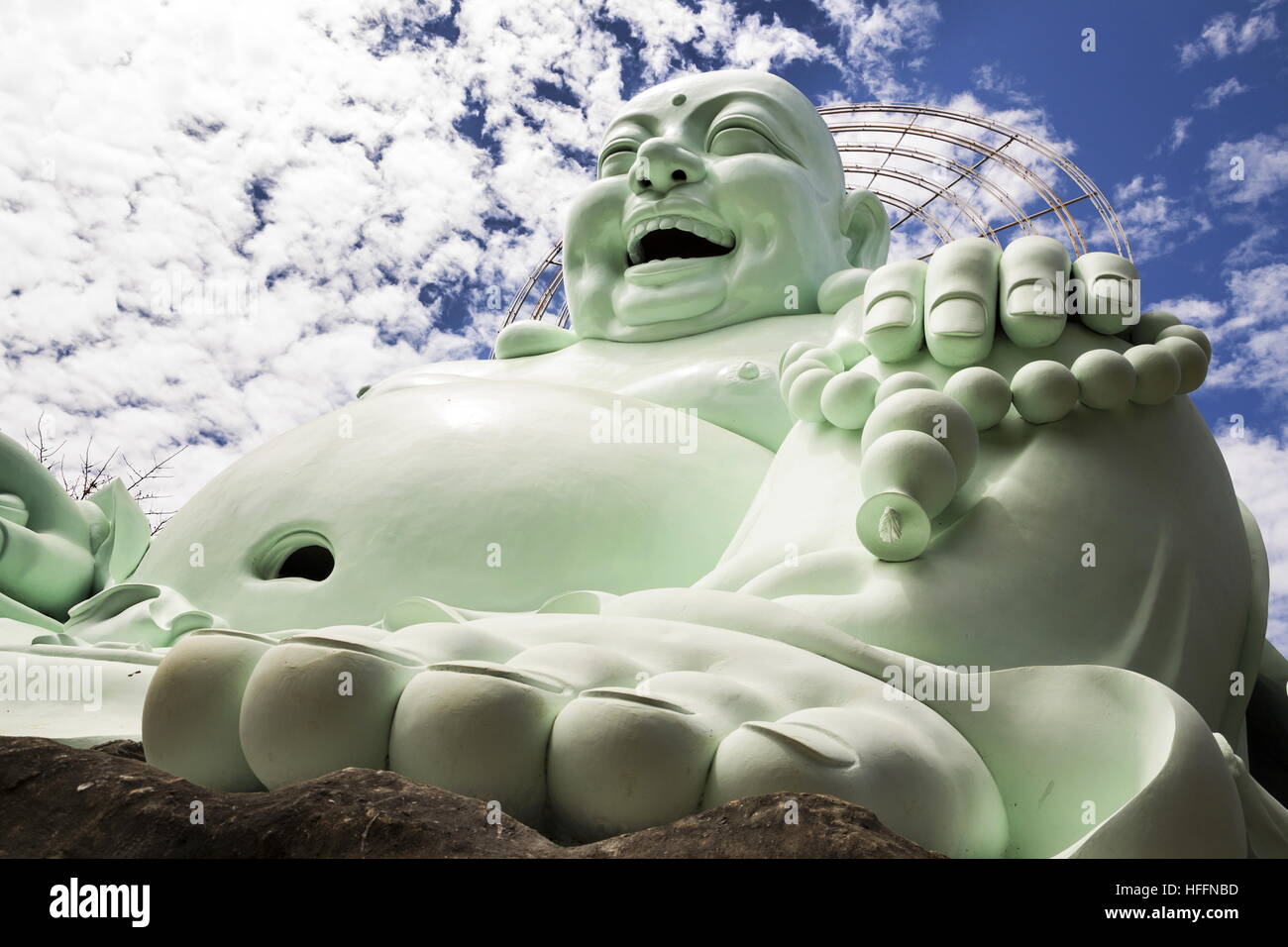 Statue of sitting and smiling Laughing Buddha statue near Linh An Tu ...