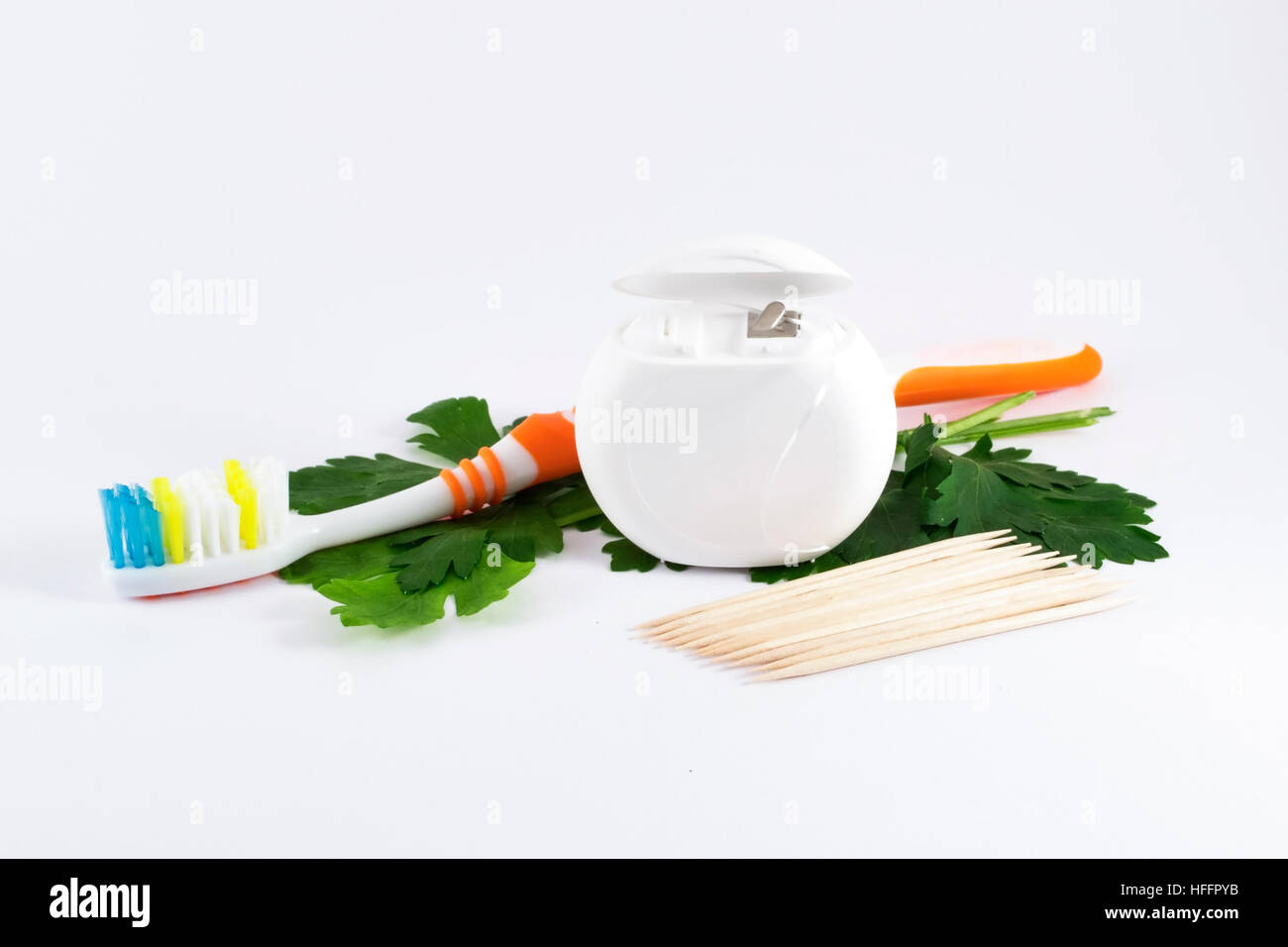 Toothbrush,dental floss and toothpicks on white background Stock Photo ...