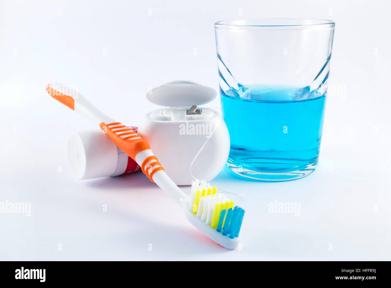 Toothbrush, dental floss, toothpaste and mouthwash on white background ...