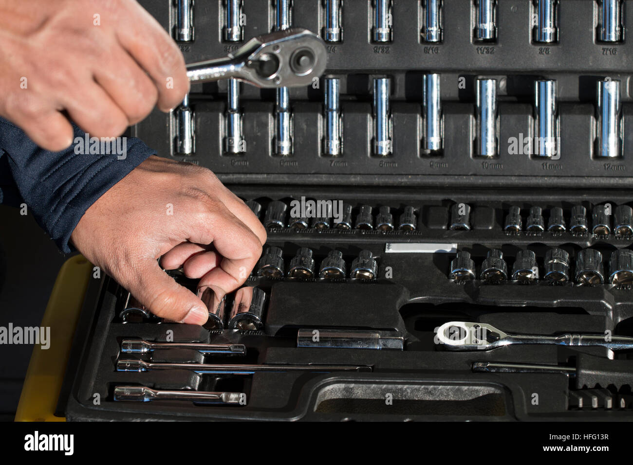 Selecting Tools from a black Toolbox Stock Photo - Alamy