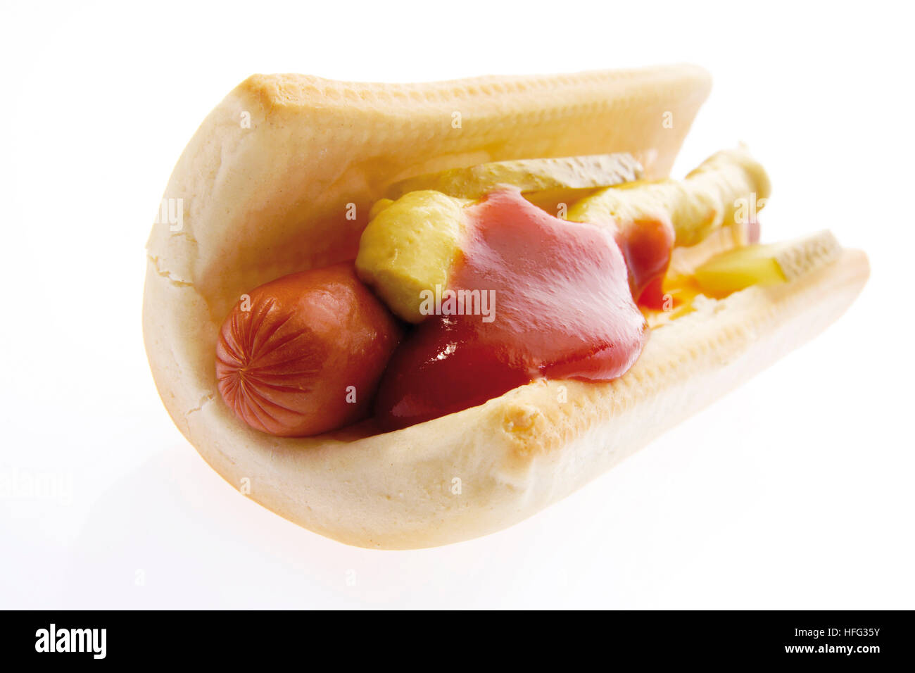 Hot dog with mustard, ketchup and pickle Stock Photo - Alamy