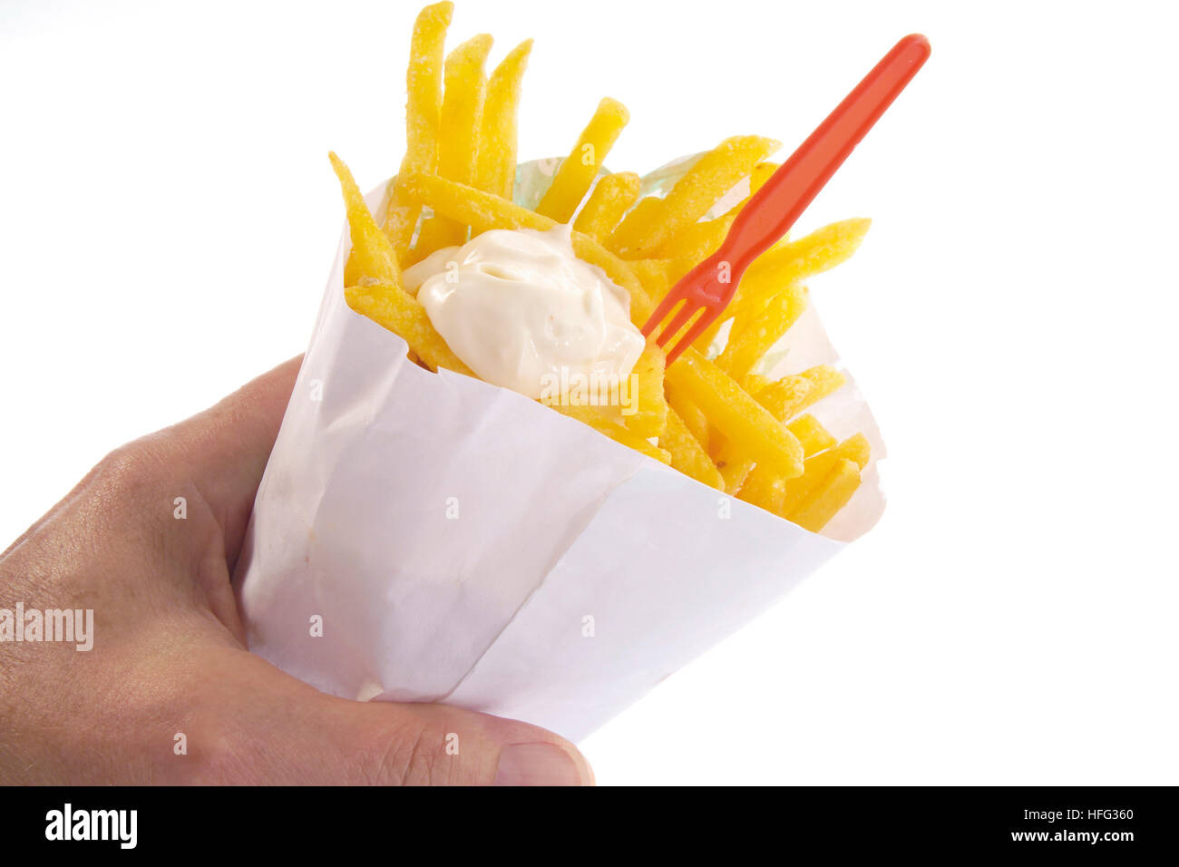Hand holding french fries with mayonnaise Stock Photo - Alamy