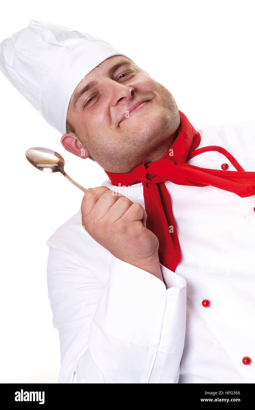 Chef holding spoon in his hand, grinning Stock Photo - Alamy