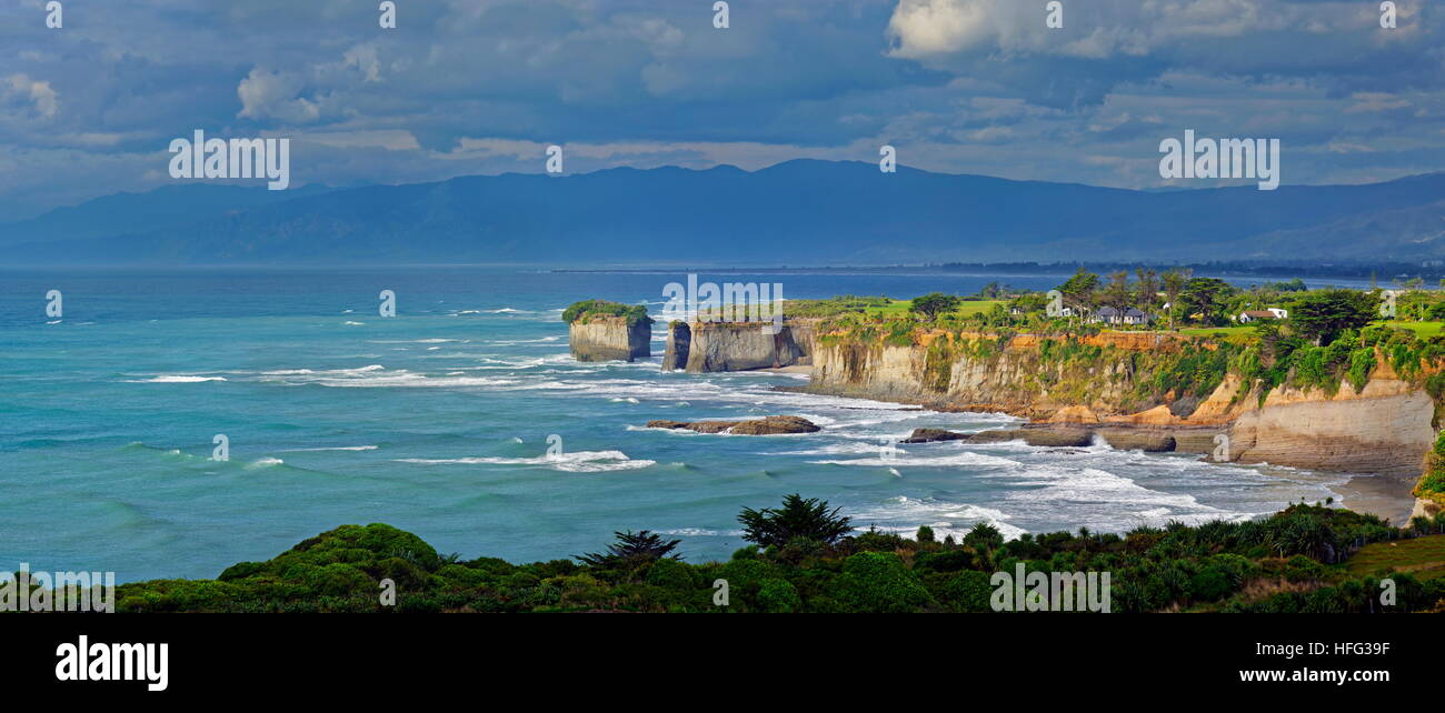 Bizarre limestone cliffs of Waterfall Beach at Cape Fallwind, Westport ...