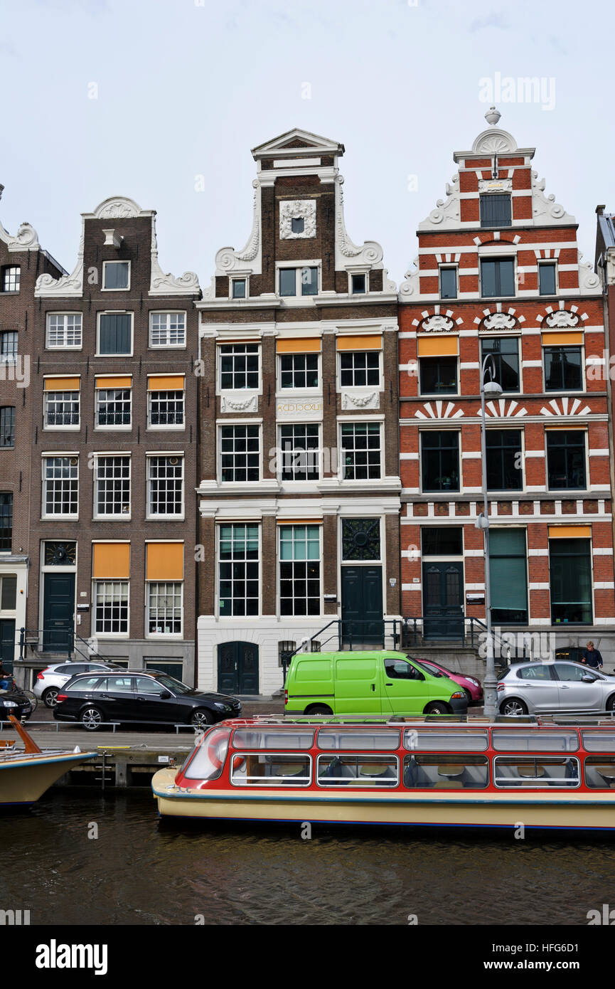 Traditional dutch buildings by the canal in Amsterdam, Holland ...