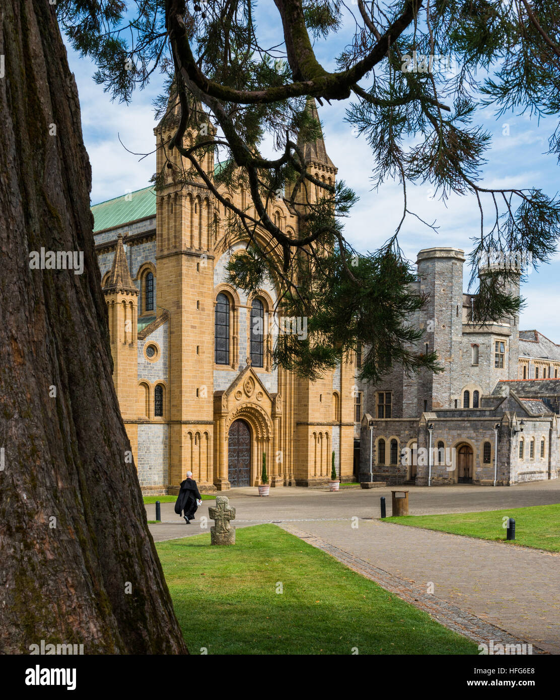 A monk walks towards the Abbey entrance Stock Photo - Alamy