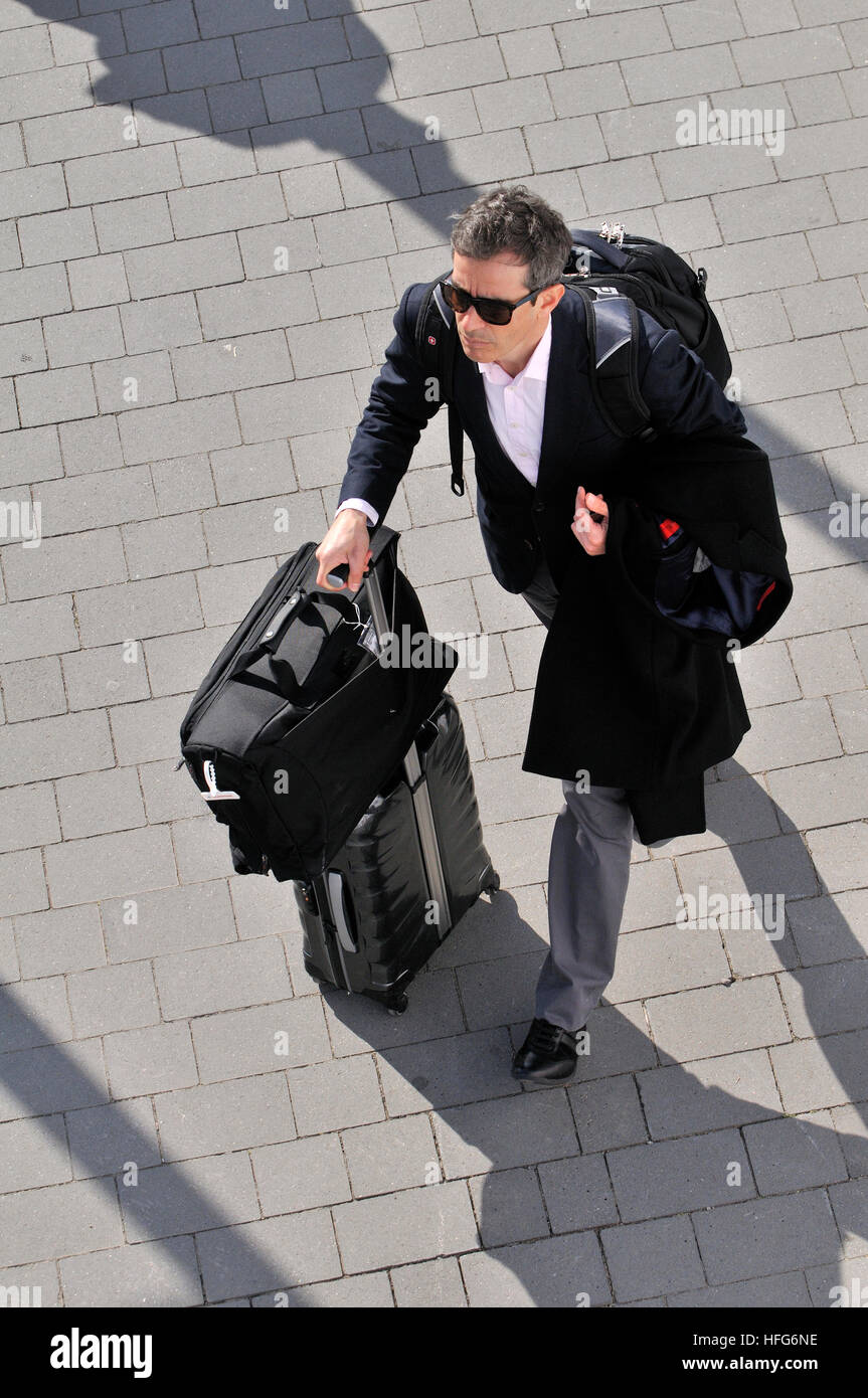 Business man with trolley Stock Photo - Alamy