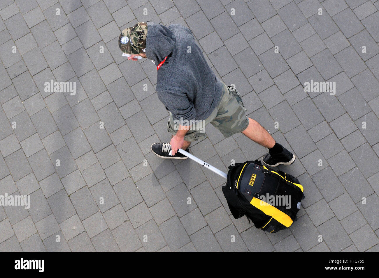 Man walking with trolley Stock Photo - Alamy