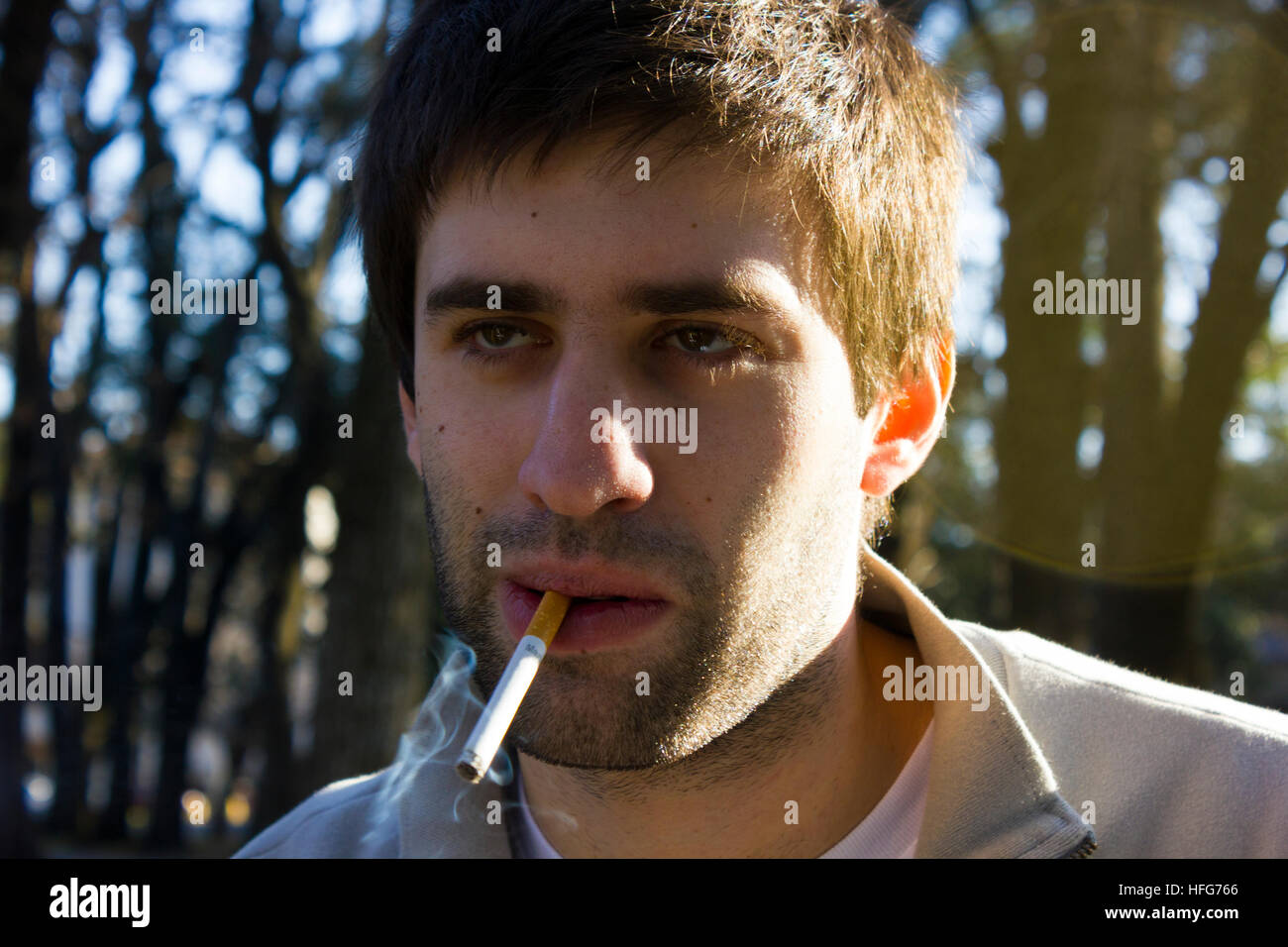American adult man smoking cigarette hi-res stock photography and ...