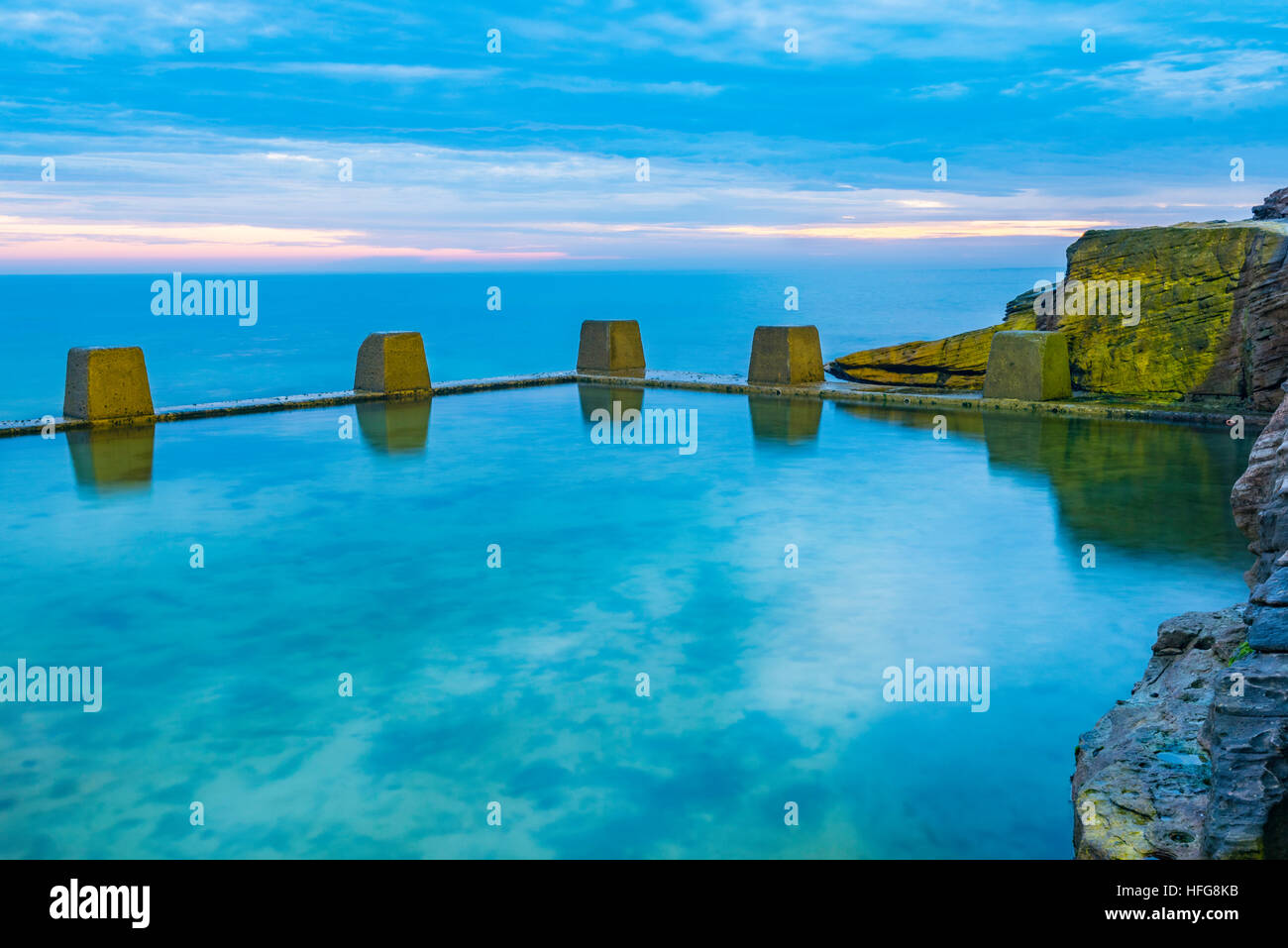 Negative space with clouds reflecting in an ocean pool at the Sydney's ...