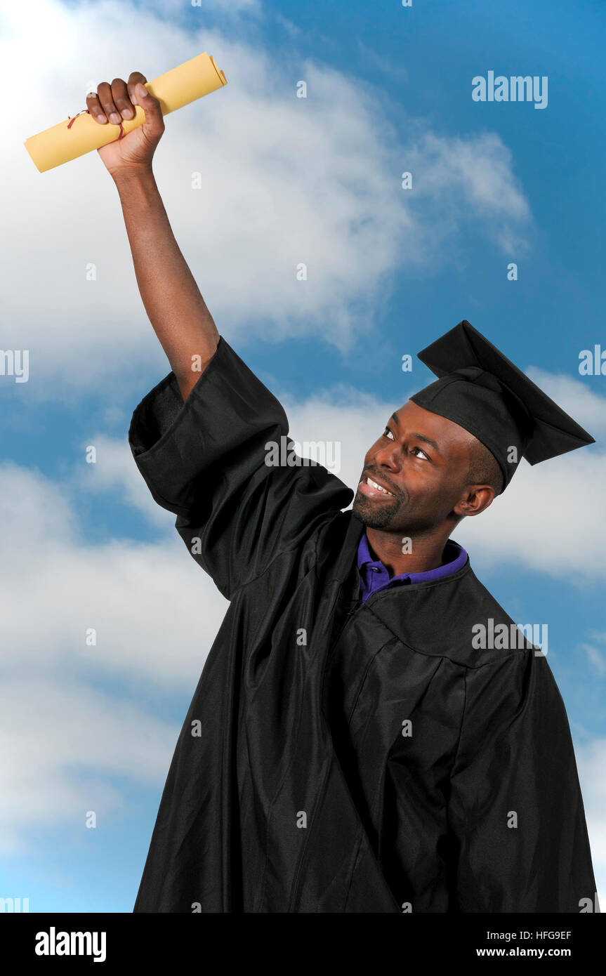 Young man in his graduation robes Stock Photo - Alamy
