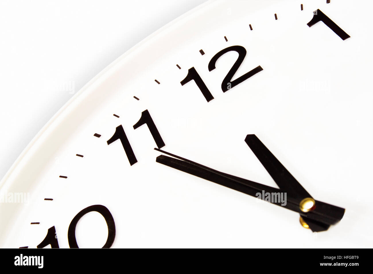 Clock showing five-to-twelve Stock Photo - Alamy