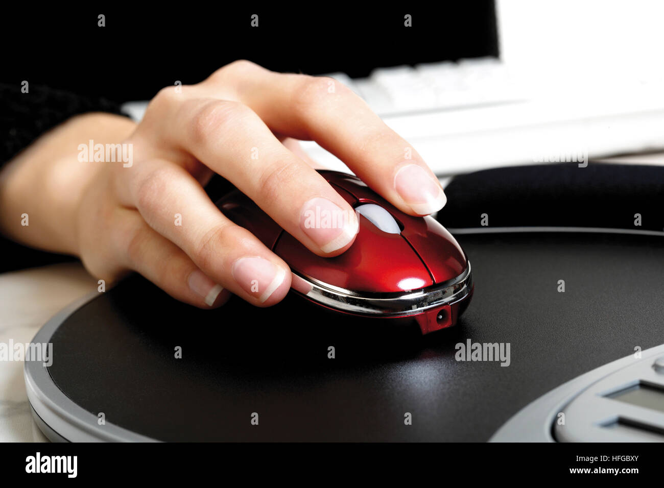 Female hand held over a computer mouse Stock Photo - Alamy