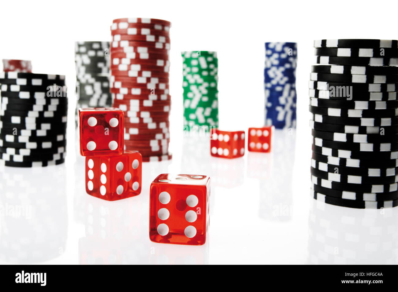 Stacked poker chips and red die Stock Photo - Alamy