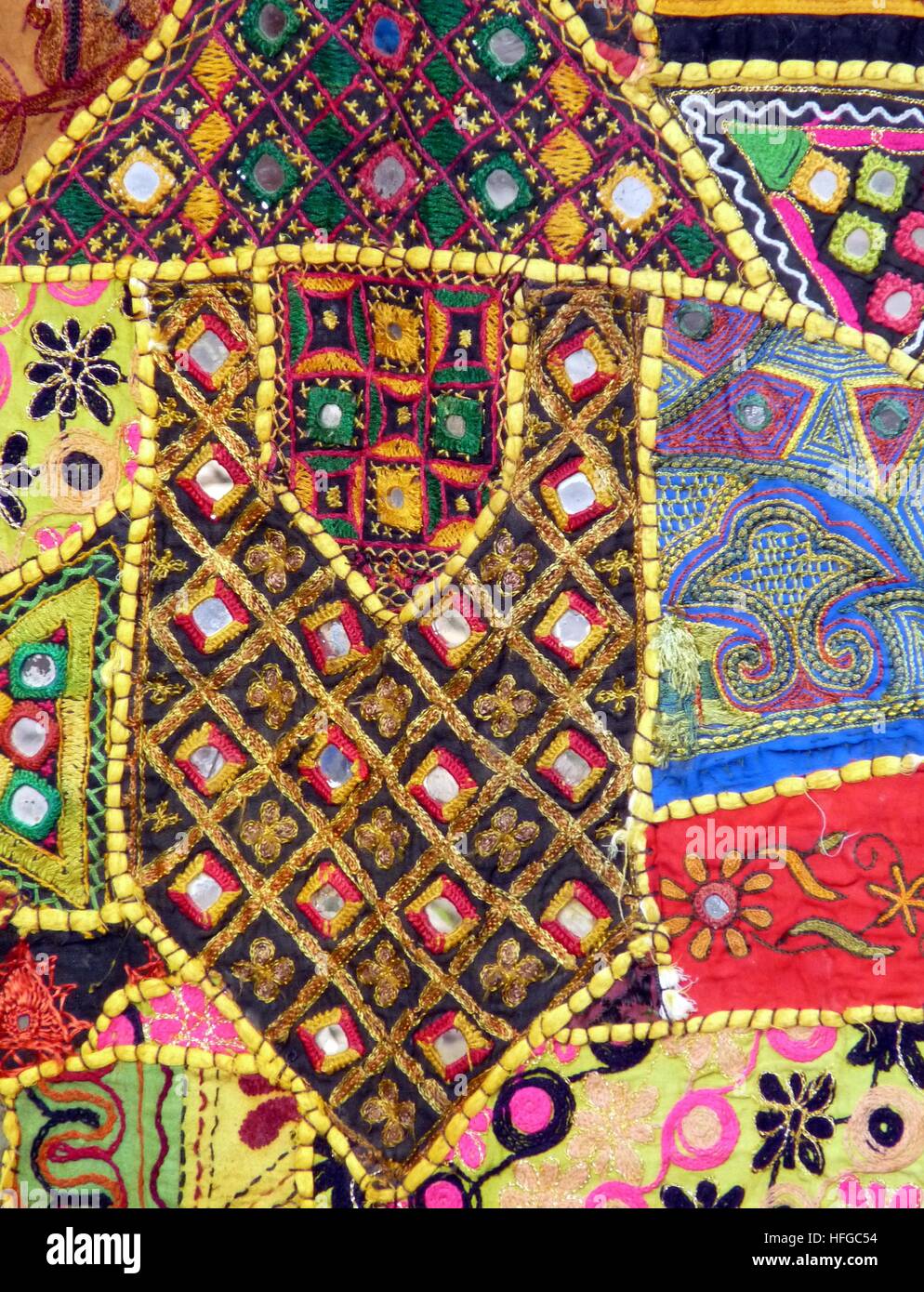 Close-up of part of a colourful, hand-sewn traditional Nepalese cloth ...