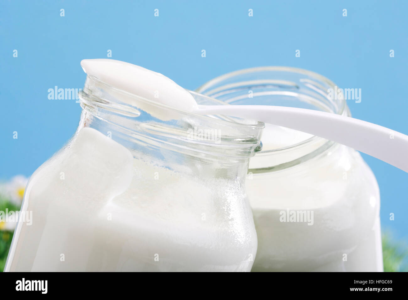 Glasses of yoghurt, sky blue background Stock Photo - Alamy