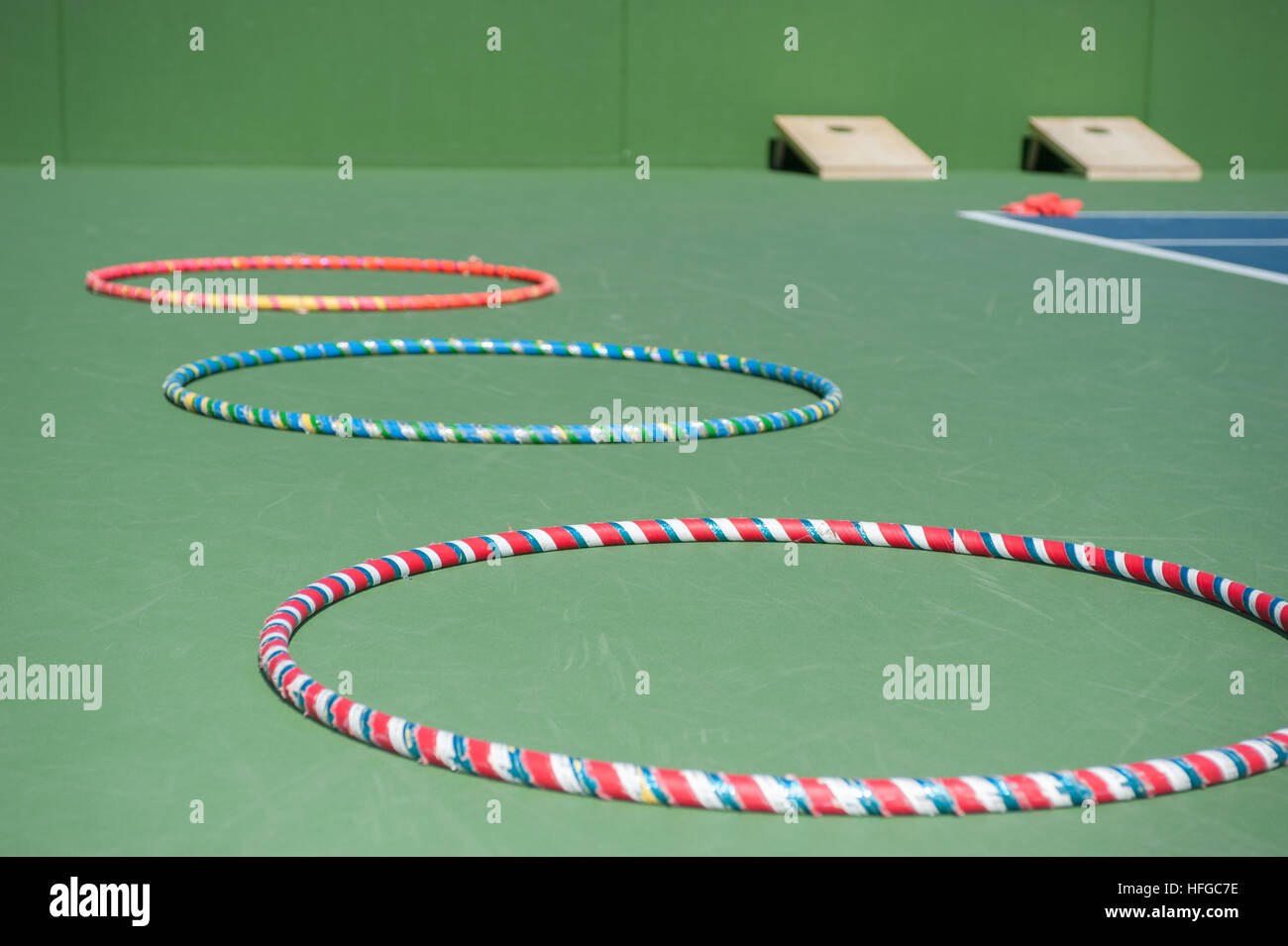 Party games involving hula hoops ready to play Stock Photo - Alamy