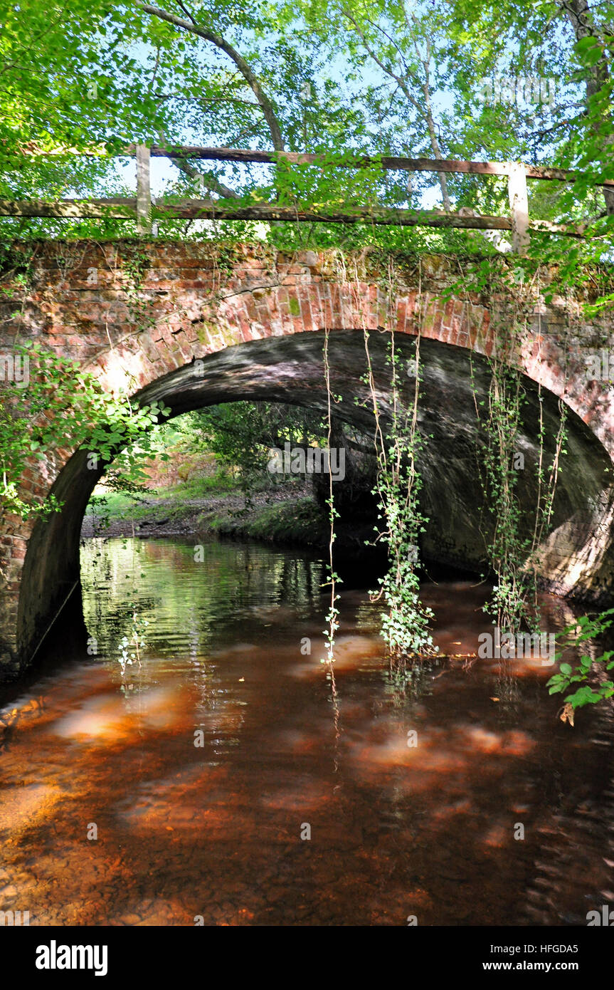 Old Roman bridge over Highland Water stream in the New Forest National ...