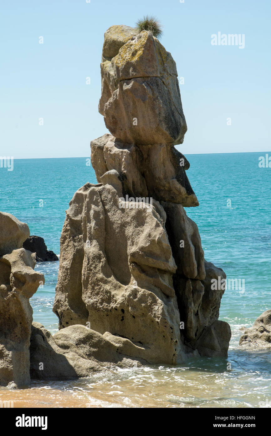 Rocky outcrops and needles divide the golden beaches of Anapai Bay at ...