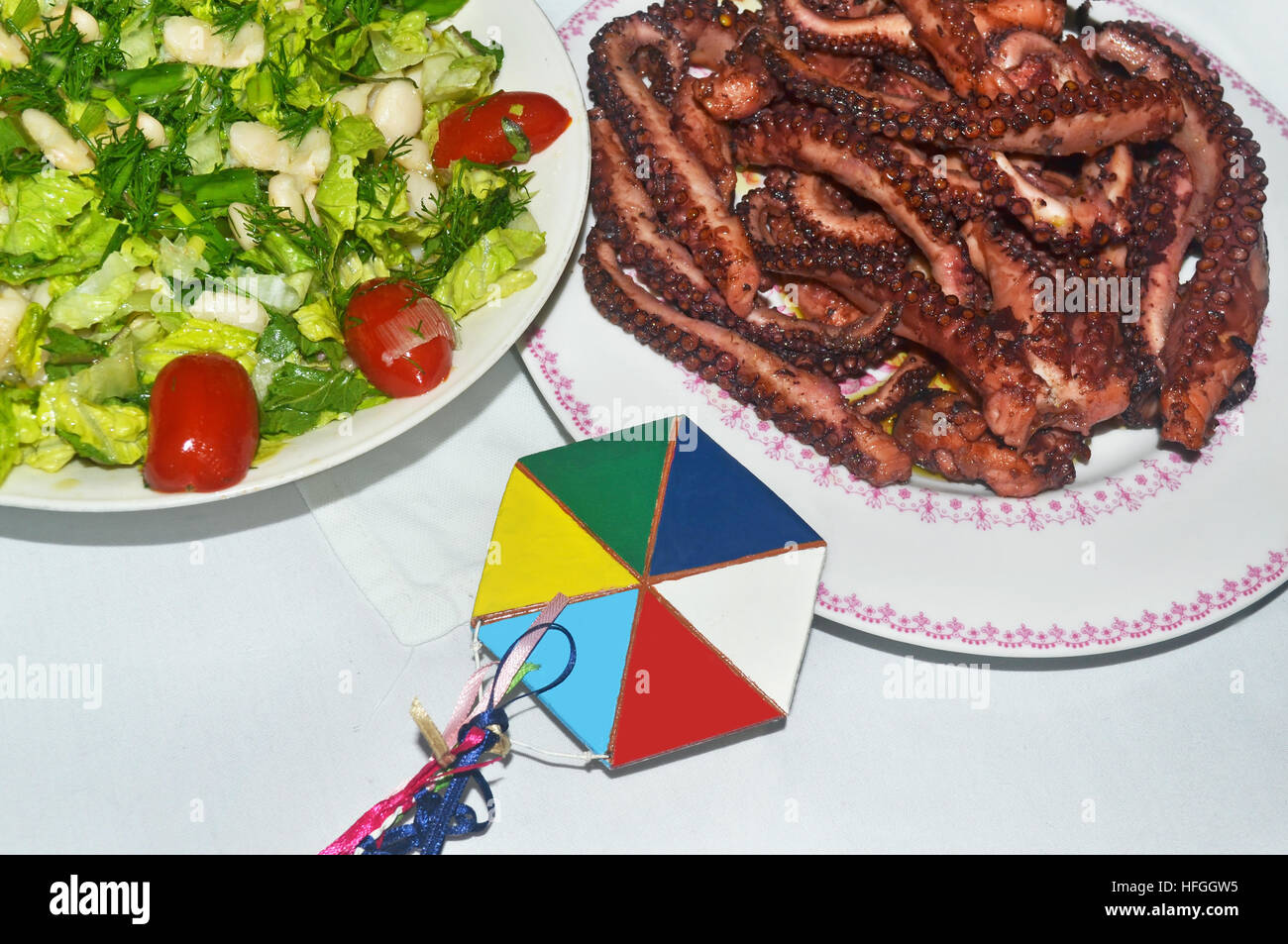 Clean Monday food - bean salad and roasted octopus Stock Photo - Alamy