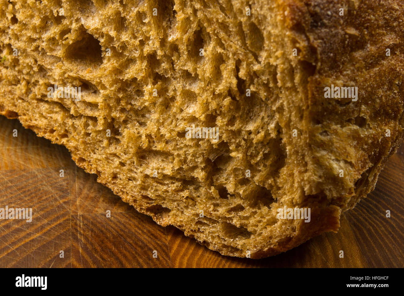 cut malt bread handmade on wooden background Stock Photo - Alamy