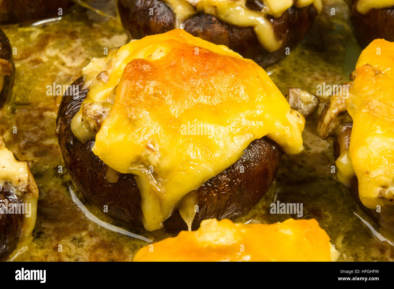 Royal baked stuffed mushrooms champignons with cheese in the pan Stock ...