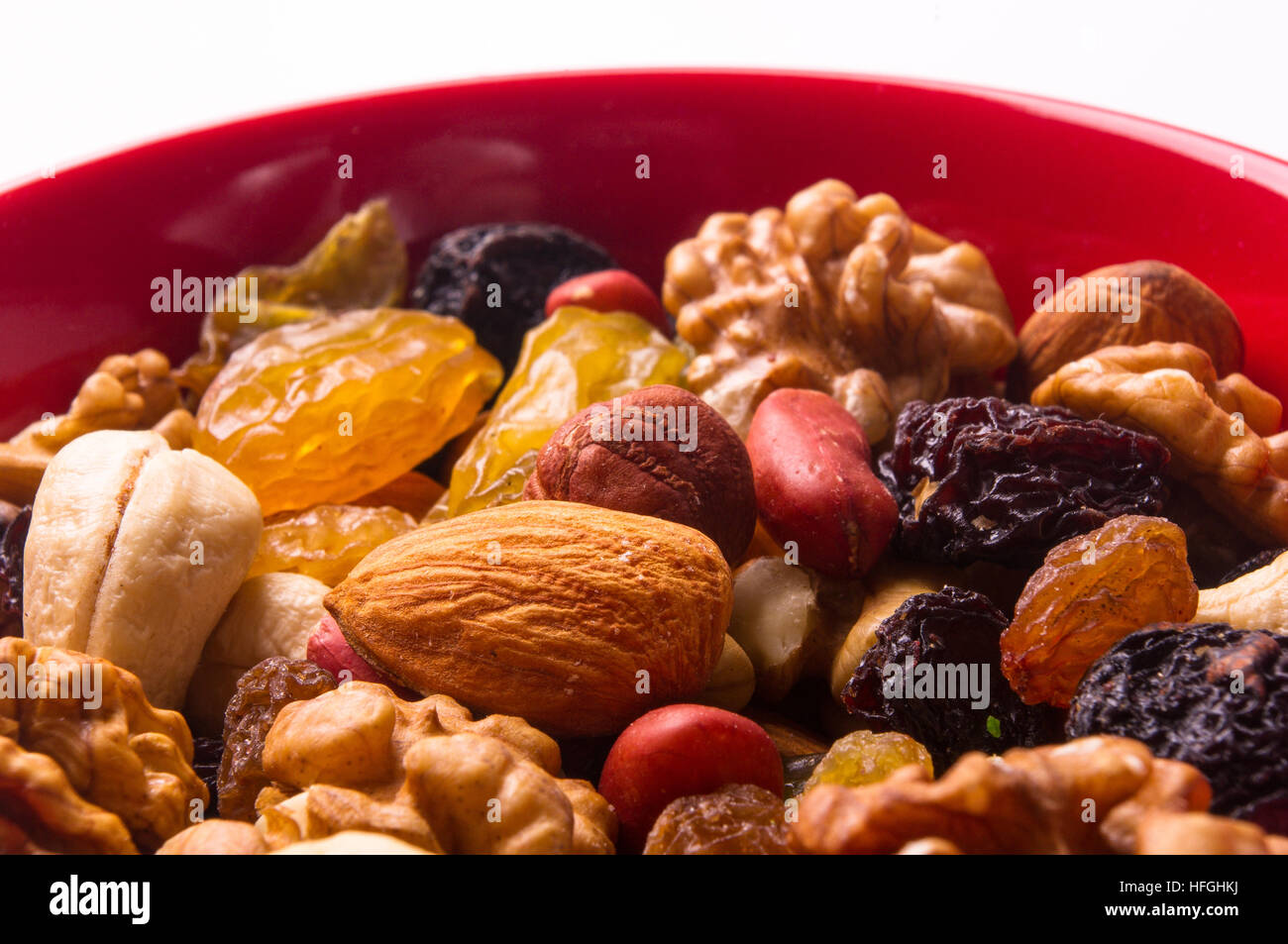 various different mixed nuts and raisins on white background Stock ...