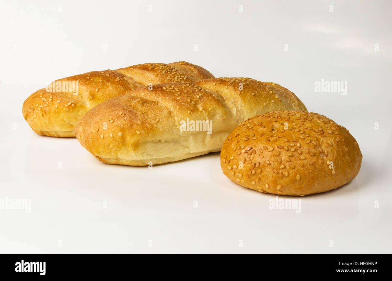 set whole wheat breads and bun on white background Stock Photo - Alamy