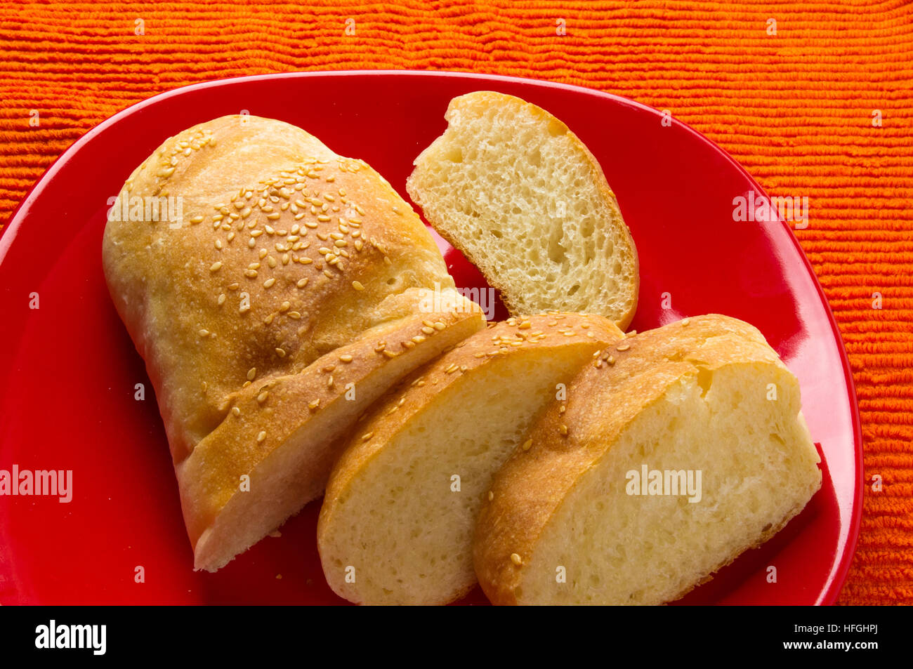 sliced whole wheat breads on a red plate Stock Photo - Alamy