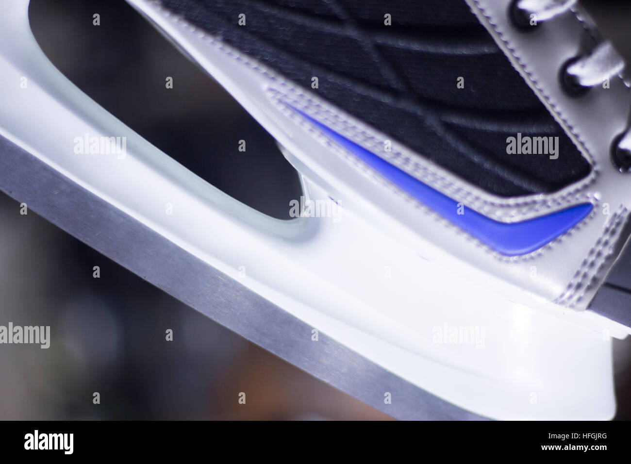 Ice skates in skate store shop window on display on sale for skating on ...