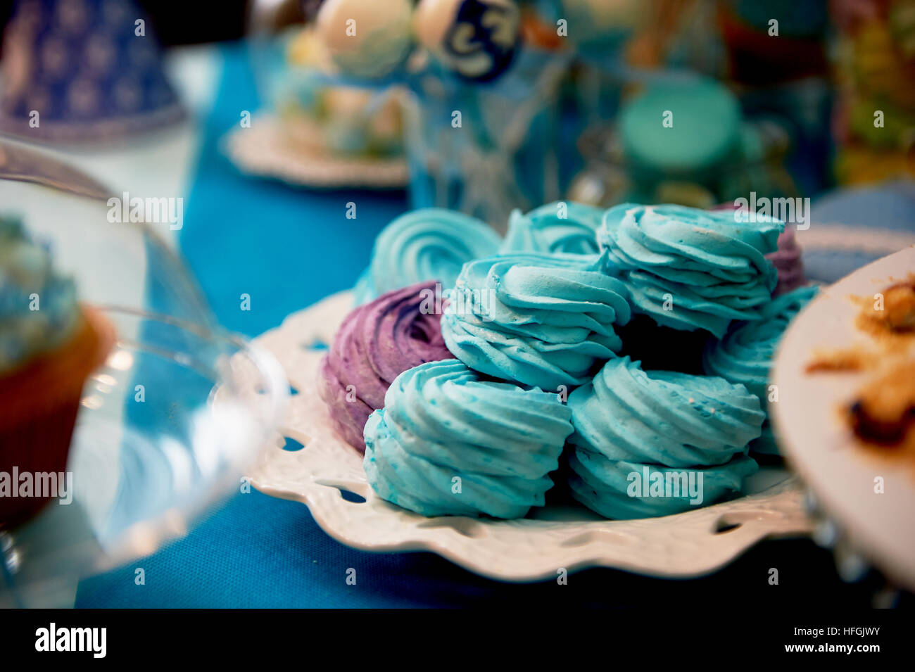 Sweet table for children's birthday party in turquoise and purple. A ...