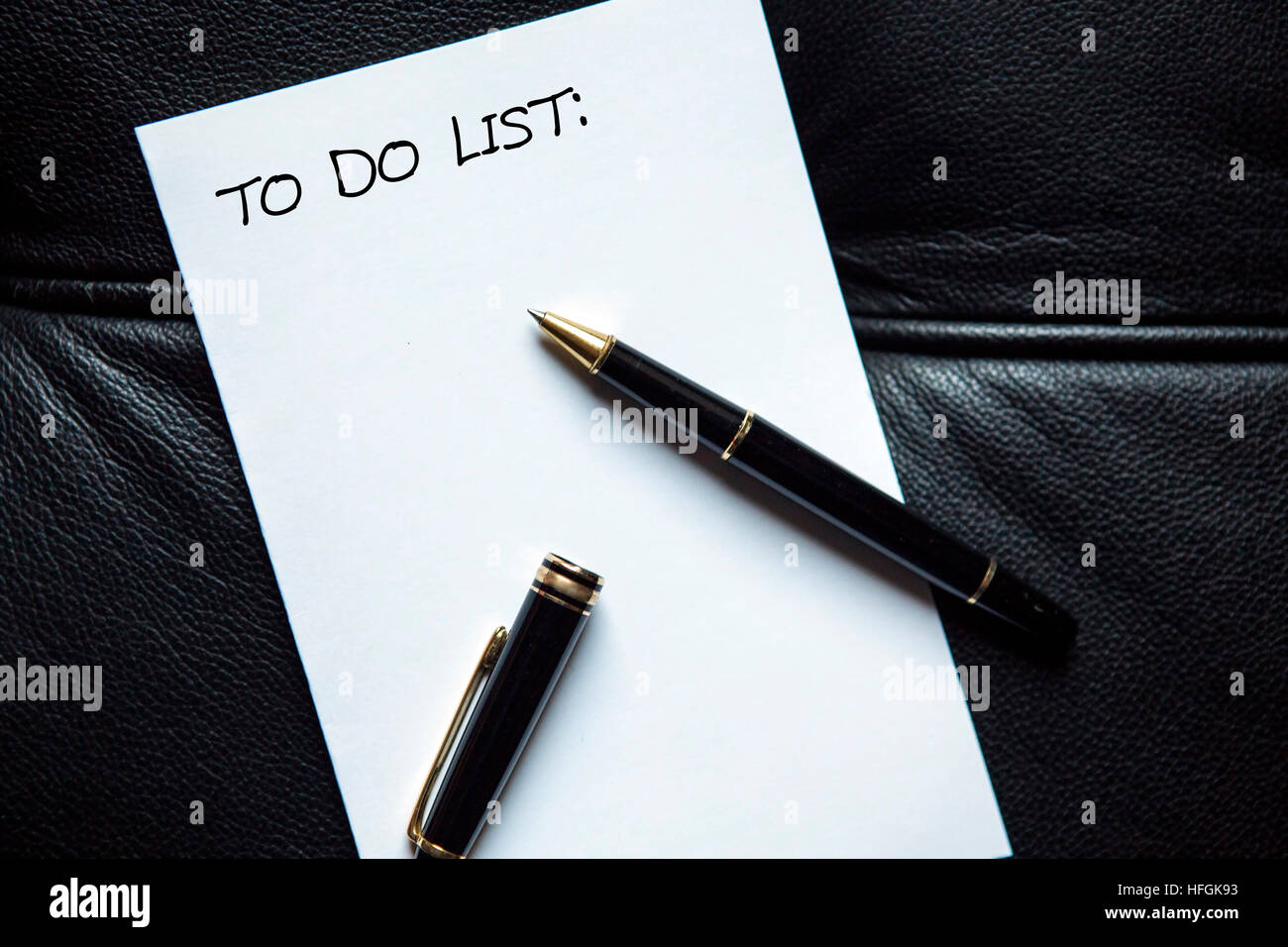 pen and the words To Do List written on white paper Stock Photo - Alamy