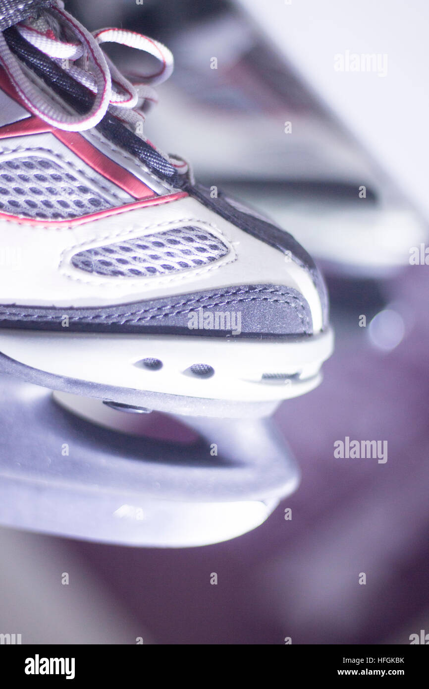 Ice skates in skate store shop window on display on sale for skating on ...