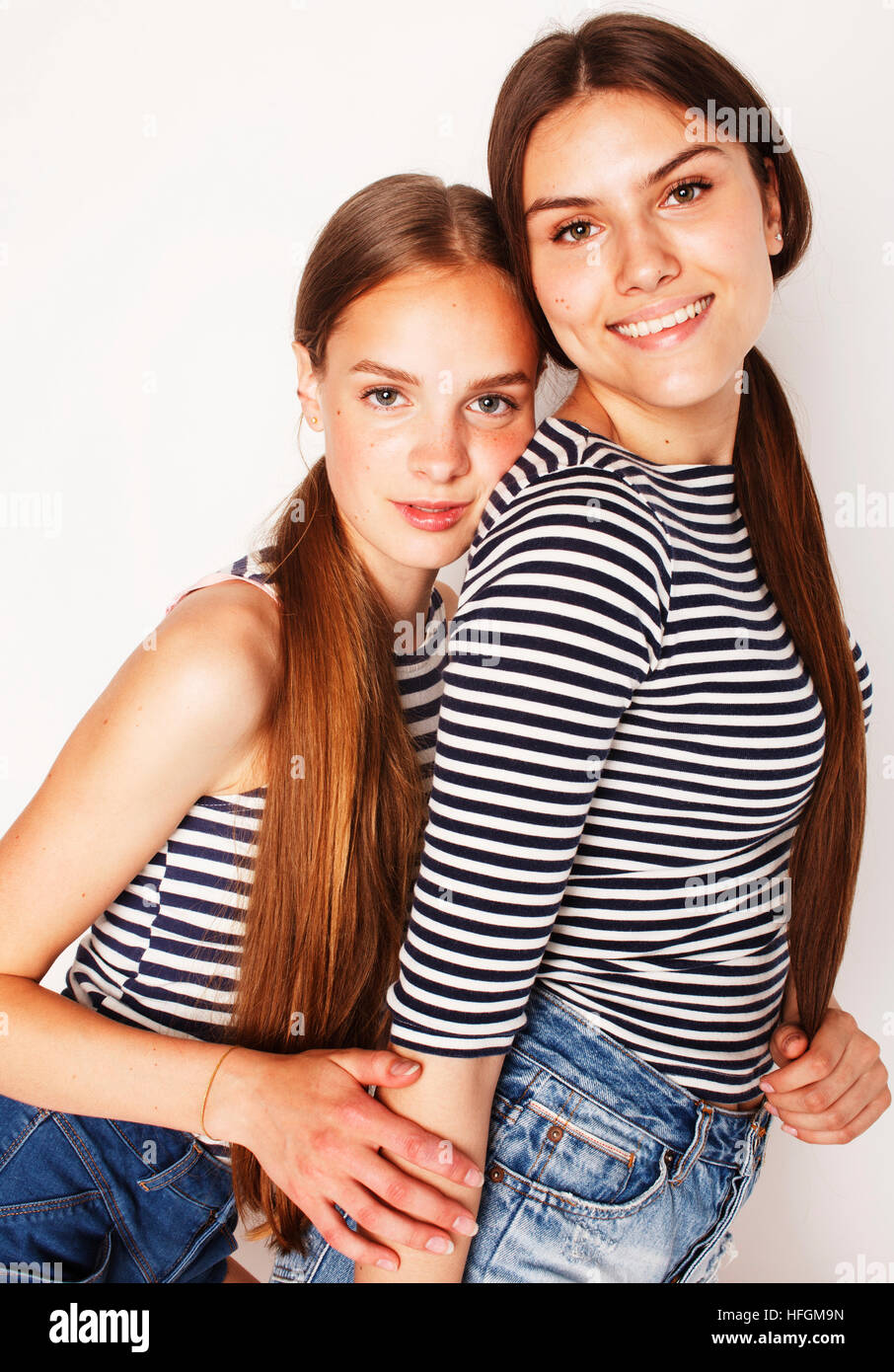 two cute teenagers having fun together isolated on white Stock Photo ...