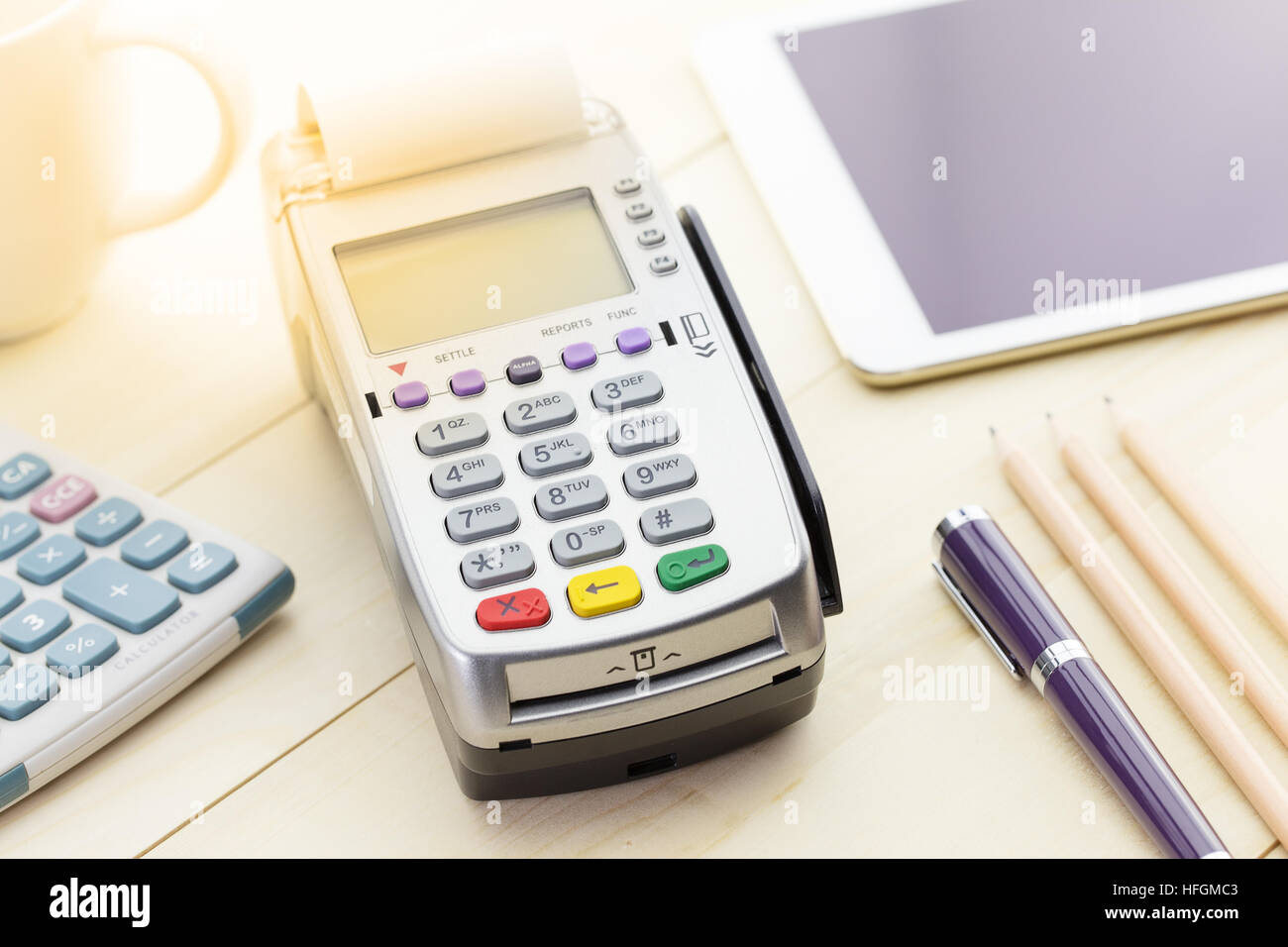 Credit Card Terminal or EDC on cashier wooden table in the store with ...