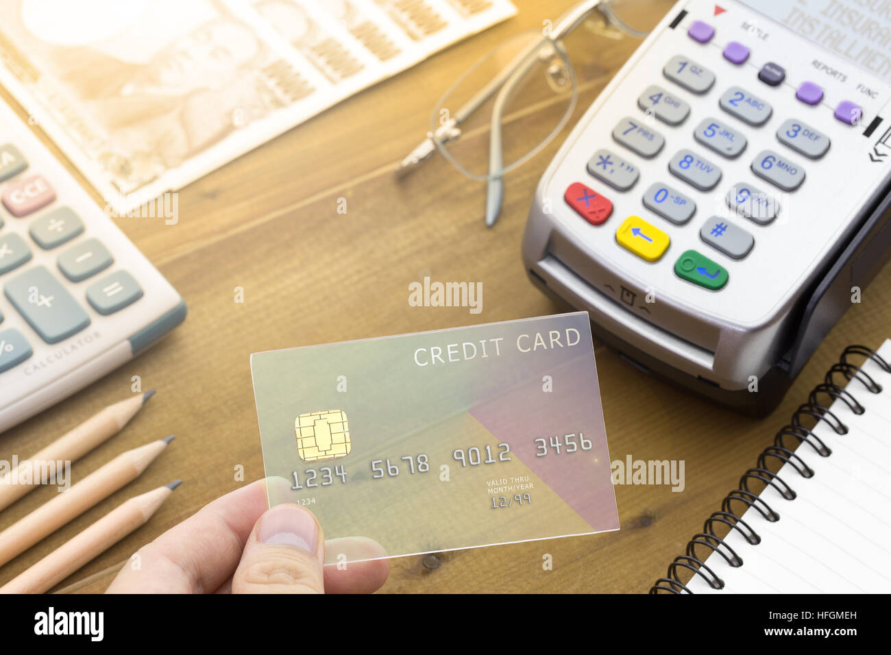 Cashier hand holding a Credit card over EDC machine or credit card ...