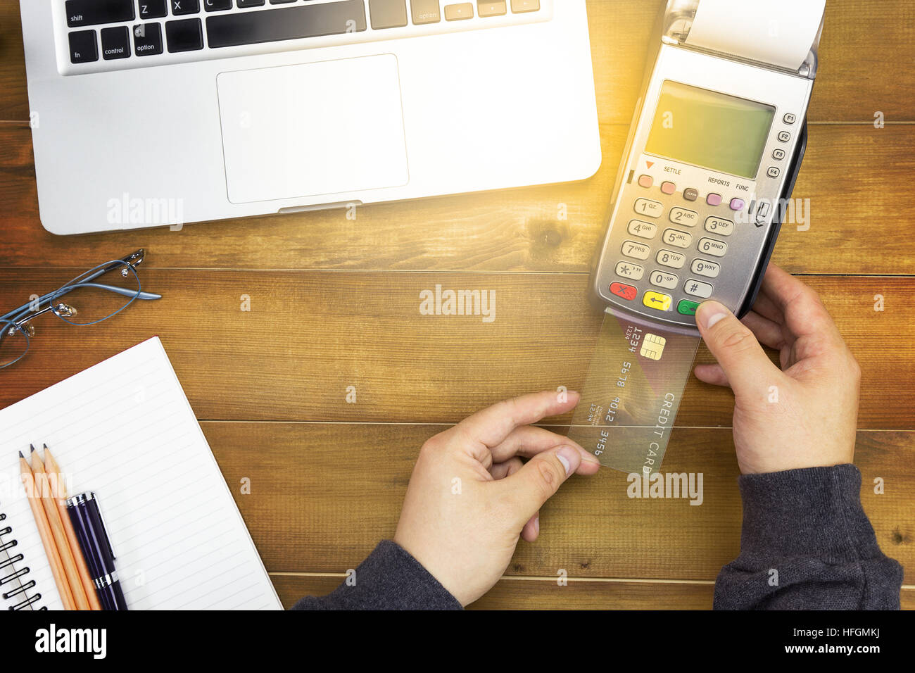 Cashier hand holding a Credit card over EDC machine or credit card ...