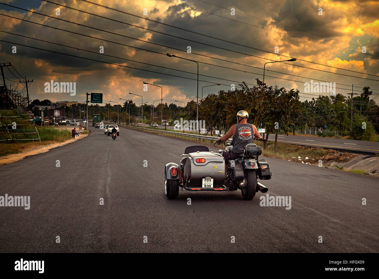 Motorcycle sidecar. Motorcyclist riding customised motorbike and ...