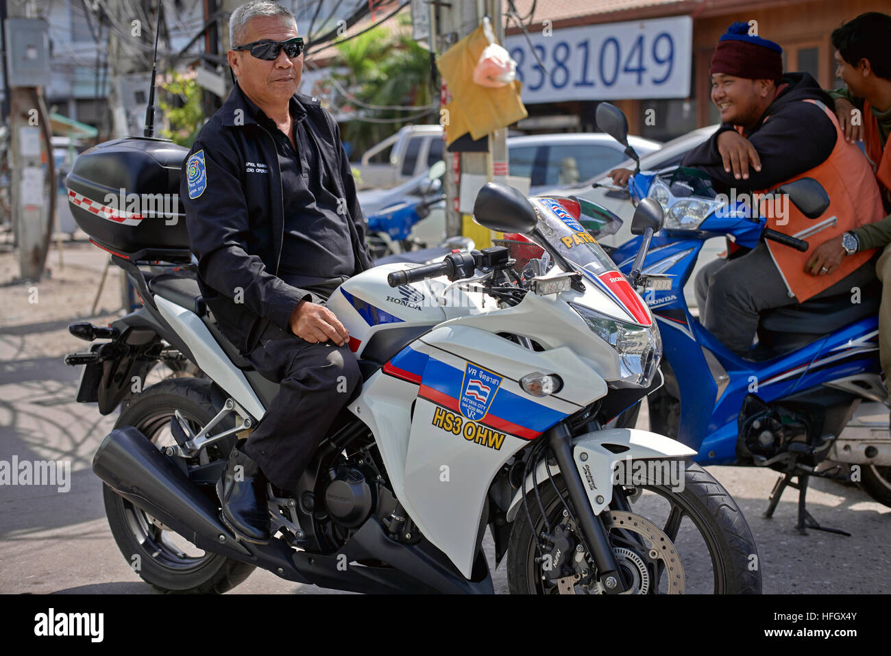 Volunteer police assistance person and powerful motorcycle. Thailand S ...