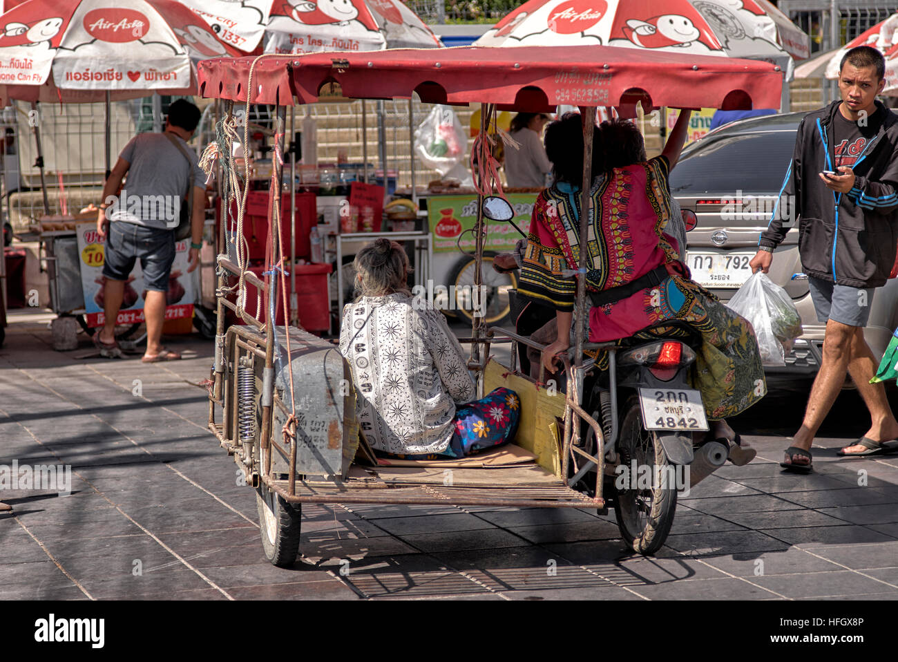 Motorcycle and sidecar utilised to transport family. Thailand S. E ...