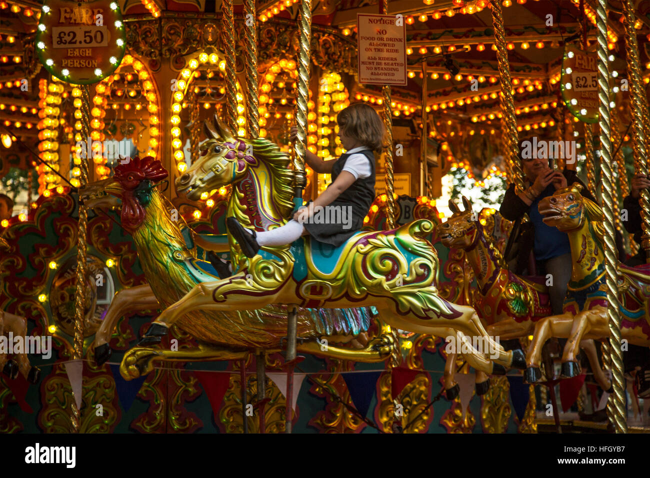 Girl on the Golden Galloper Carousel, St Giles Fair Oxford Stock Photo ...