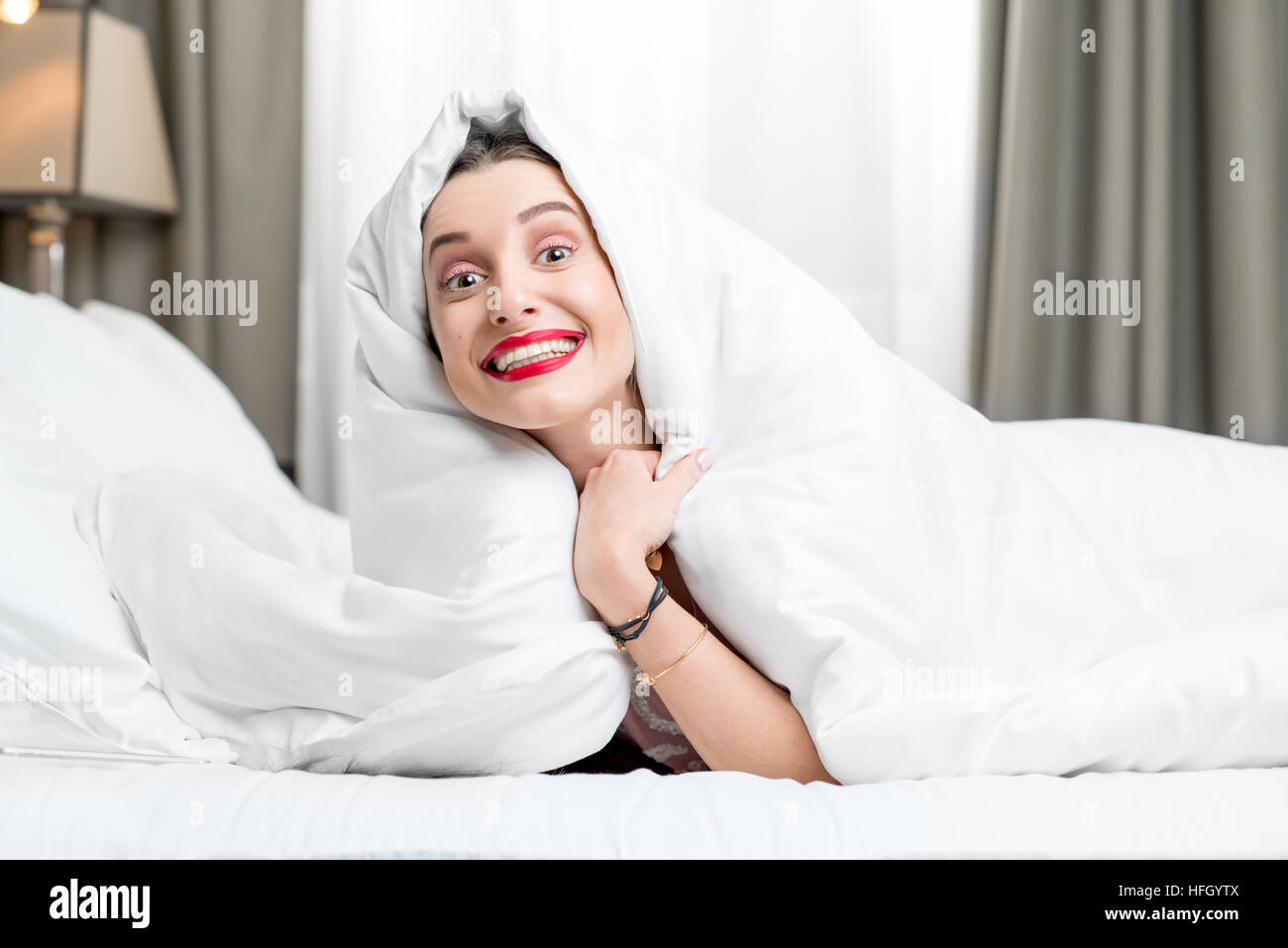 Woman under sheets hi-res stock photography and images - Alamy