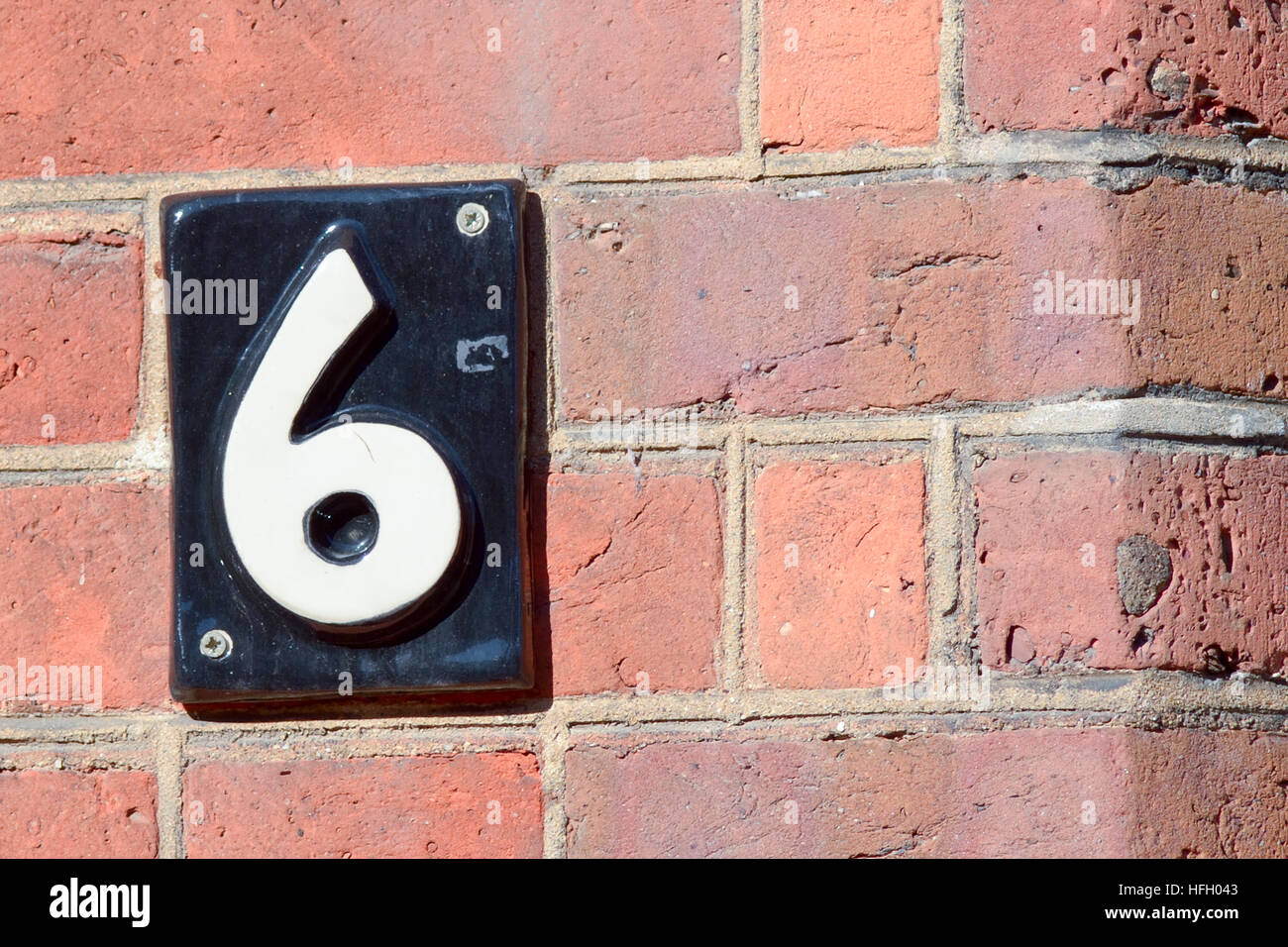 House Number 6 sign on wall Stock Photo - Alamy