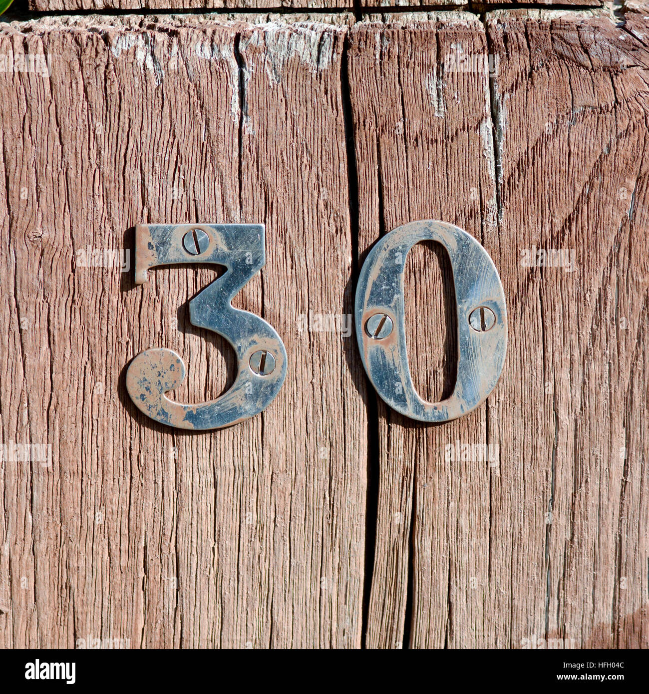 House number 30 sign on wooden gate Stock Photo - Alamy