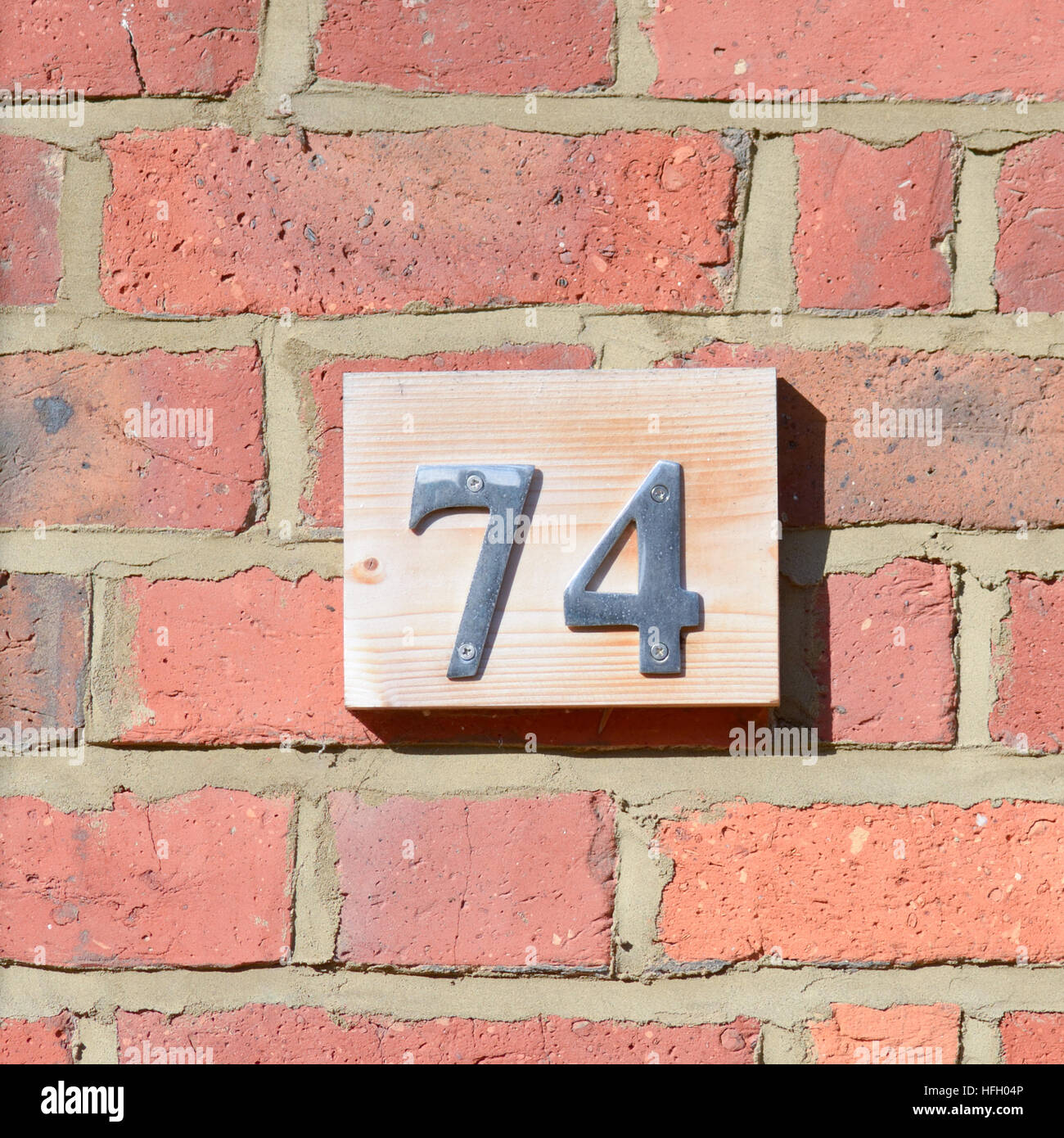 House Number 74 sign on wall Stock Photo - Alamy